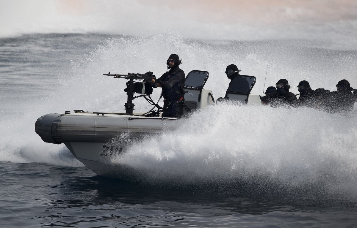 An Indian Navy RIB operated by MARCOS cuts through the water during IFR ...